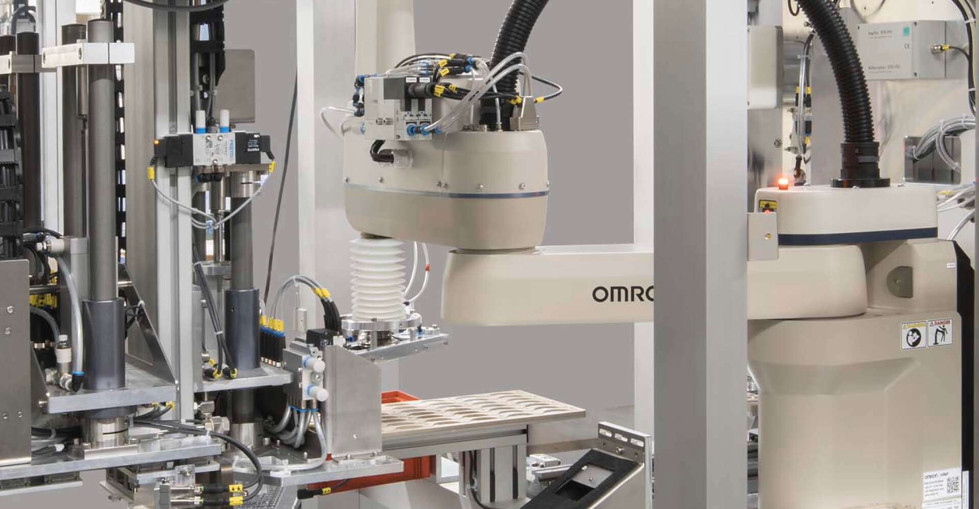 Battery assembly and check in 70 seconds with Omron robotics | Omron ...